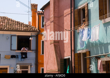 Neighbors hanging wash from line Burano Italy Stock Photo - Alamy