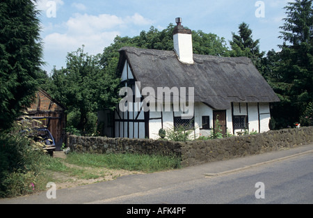 English country cottage half timbered house by ford stream Little ...