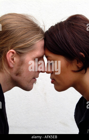 Hongi Maori greeting male and female in profile Stock Photo - Alamy