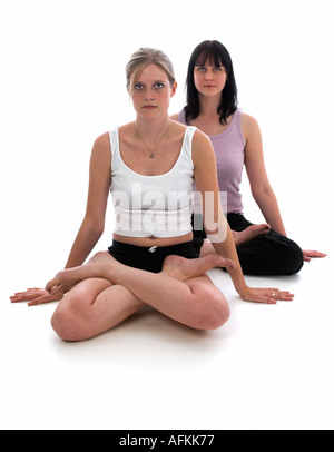 People in lotus positions on beach Stock Photo - Alamy