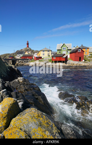 The Ona lighthouse on Onakalven above the fishing village of Ona Sandoy ...