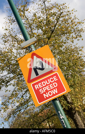 REDUCE SPEED NOW ROAD TRAFFIC WARNING SIGN Stock Photo - Alamy