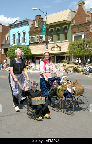 A parade float with young Dutch children at Tulip Time in Pella, Iowa ...