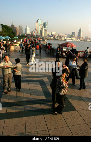 China: A Chinese man with an umbrella and long queue, c. 1900. The ...