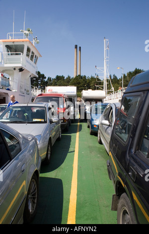 Cars lorries trucks and other road vehicles on car ferry Tarbert county ...