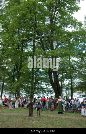 Rising of a maypole in Sweden Stock Photo - Alamy
