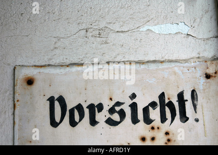 Danger sign, lettering "Vorsicht", German for "Caution", wind turbine ...