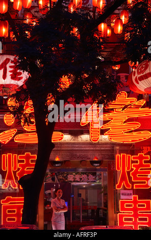 Neon signs and red lanterns at night illuminating menu at Chinese Stock ...