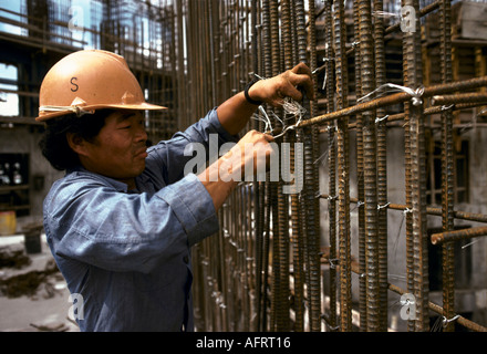 Singapore building site on reclaimed land. Construction workers. Circa ...