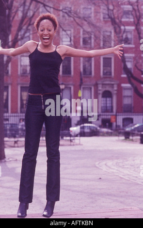Woman exulting in park Stock Photo - Alamy
