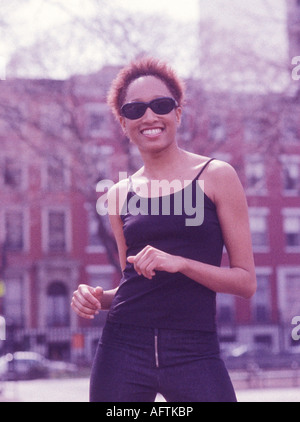 Woman exulting in park Stock Photo - Alamy
