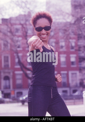 Woman exulting in park Stock Photo - Alamy