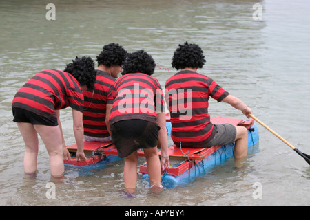Charlestown regatta Cornwall raft race baywatch babes in drag Stock ...