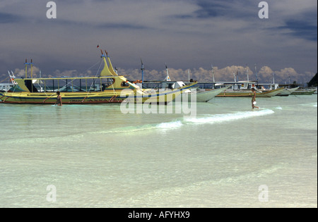 the brightly painted boats at the spectacular Boracay beach Island in ...