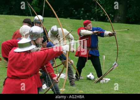 Medieval re enactment Archery long bows spectators coats of arms ...