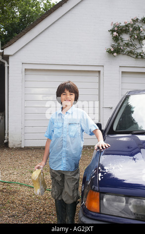 Full length portrait of car wash worker man, wearing protective clothes ...