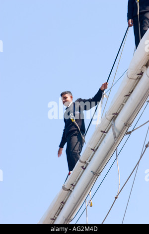 Crew members display on masts and sails of Indian Navy training ship ...