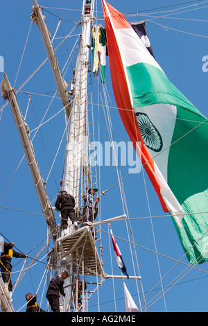 Crew members display on masts and sails of Indian Navy training ship ...