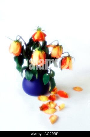 Wilted Roses in blue Vase Stock Photo - Alamy