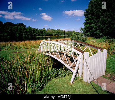 Wooden footbridge over a small river, The Lake District, Cumbria, UK ...
