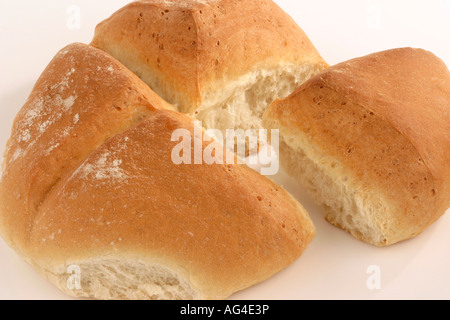 A loaf of bread divided into four quarters Stock Photo - Alamy