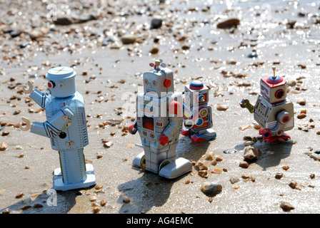 Four robots on the beach Stock Photo - Alamy