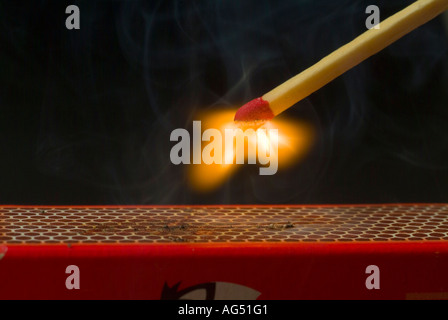 A match being struck against a matchbox Stock Photo - Alamy