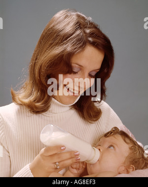 Mother feeding her baby Stock Photo - Alamy