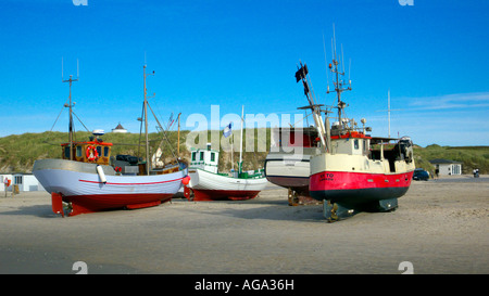 A lineup of four small Danish Fishing boats beached at Lokken in ...