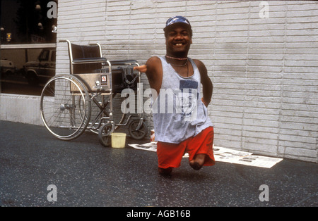 Homeless amputee in a wheelchair begging for money Stock Photo - Alamy