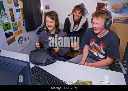 Three 15 year old boys playing computer games Stock Photo - Alamy