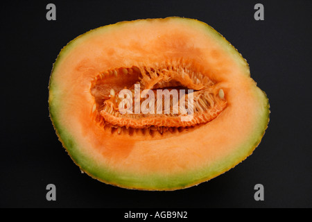 HALF A ROCKMELON BLACK BACKGROUND HORIZONTAL BAPDB8290 Stock Photo - Alamy