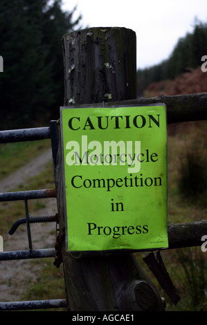 Caution Race in Progress sign and CCTV in operation sign Stock Photo ...