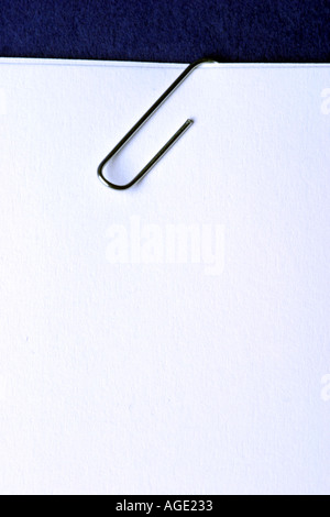 Paperclip holding sheets of paper together Stock Photo - Alamy