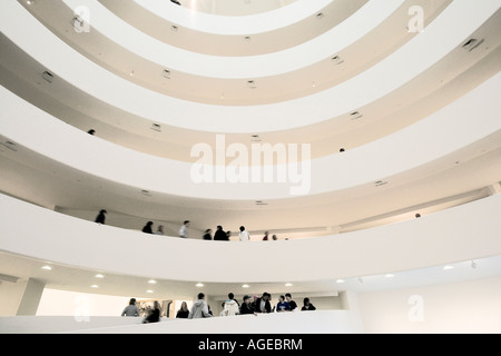 Museum goers walking up the spiral walkway at the Guggenheim museum in ...