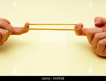 Stretching rubber band Stock Photo Alamy