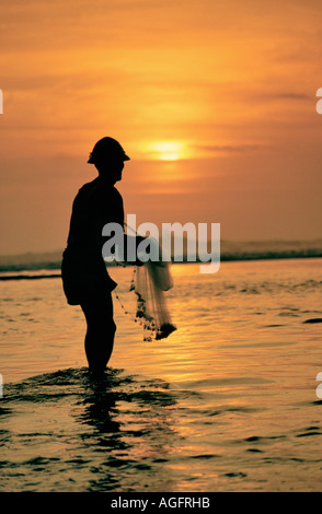 Fisherman with net, Bali Stock Photo - Alamy