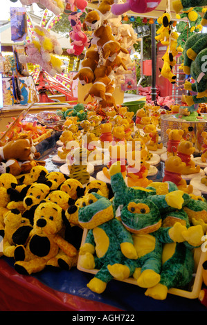 cuddly toys on display as prizes at stall at fun fair Stock Photo - Alamy