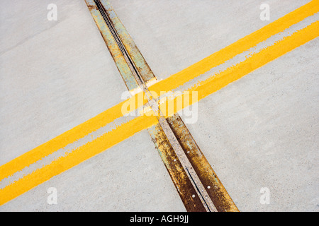 Detail of solid double yellow line in road crossing metal strips in ...