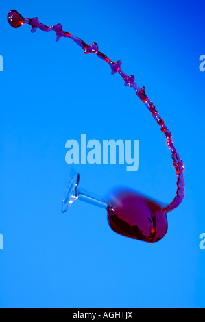 Glass of Wine Falling Mid Air with Spill Stock Photo - Alamy