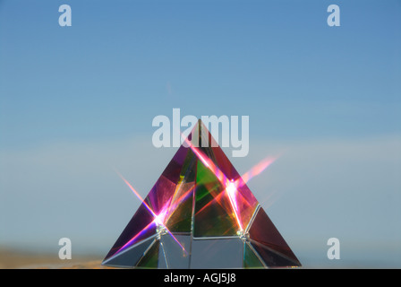 Glass pyramid with light rays reflected prism like Stock Photo - Alamy