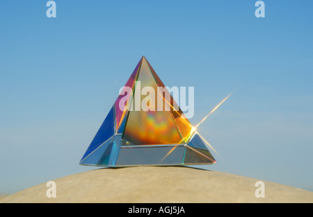 Glass pyramid with light rays reflected prism like Stock Photo - Alamy
