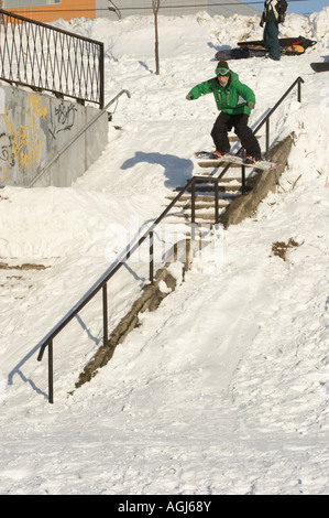 Jibbing snowboard in the city 7 Stock Photo - Alamy