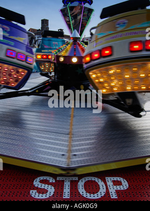 fairground funfair ride moving fast fair lights Night colours of the ...