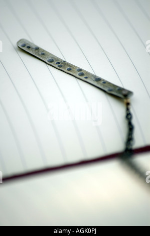 Necklace made of a sterling silver piece randomly hammered Stock Photo ...