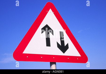 Road signs that indicate two different directions, in the opposite ...