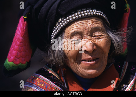 Yi woman in Tanhua, Yunnan, dressing up for the annual Flower Pinning ...