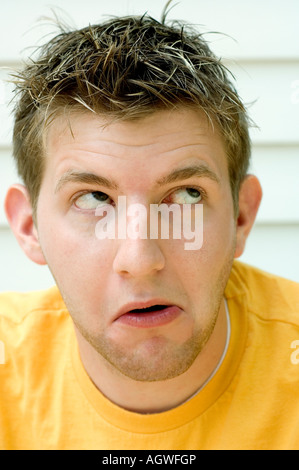 Comical funny young caucasian man making playful silly facial ...