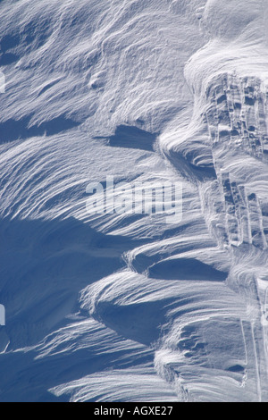 Snow patterns formed by wind blown snow beside a drystone wall, Peak ...