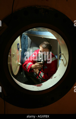 Divers training inside a hyperbaric chamber Stock Photo - Alamy